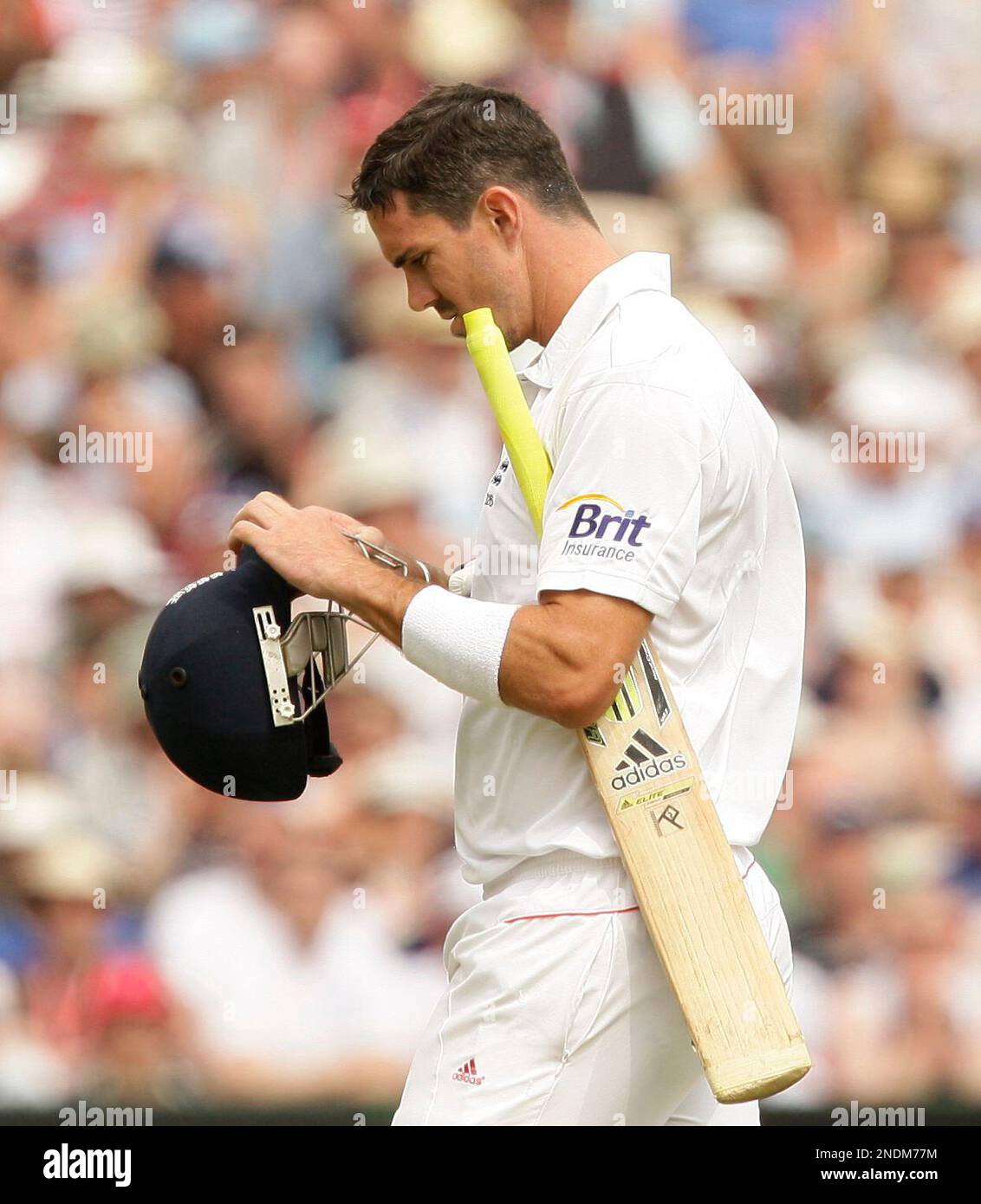 England's Kevin Pietersen walks from the crease after loosing his ...