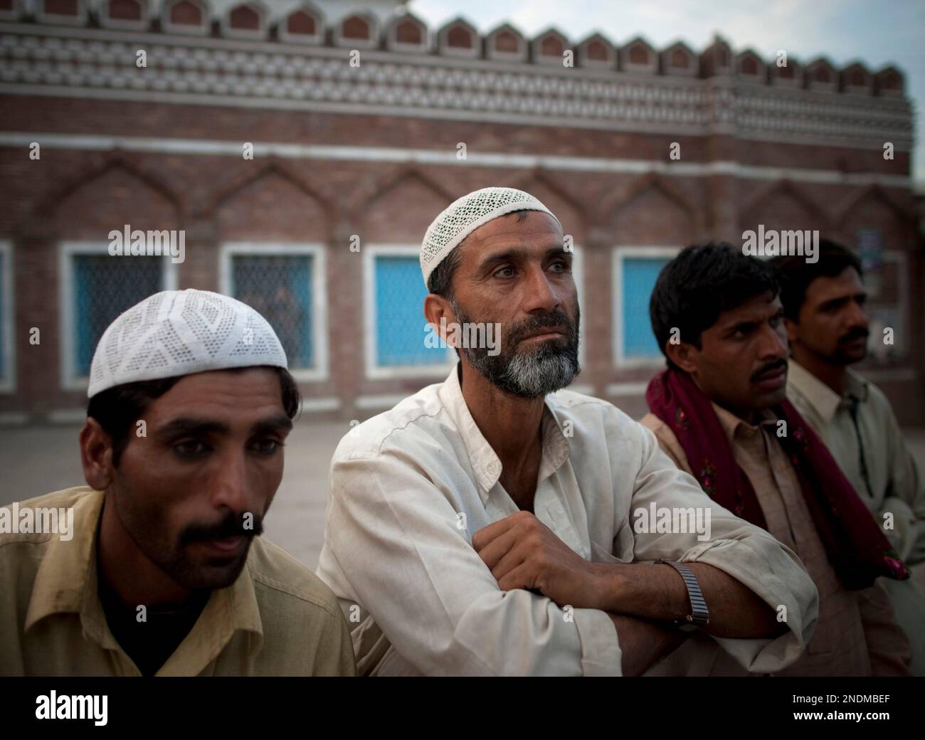 Pakistani man sit outside a mosque outskirts of Islamabad, Pakistan ...
