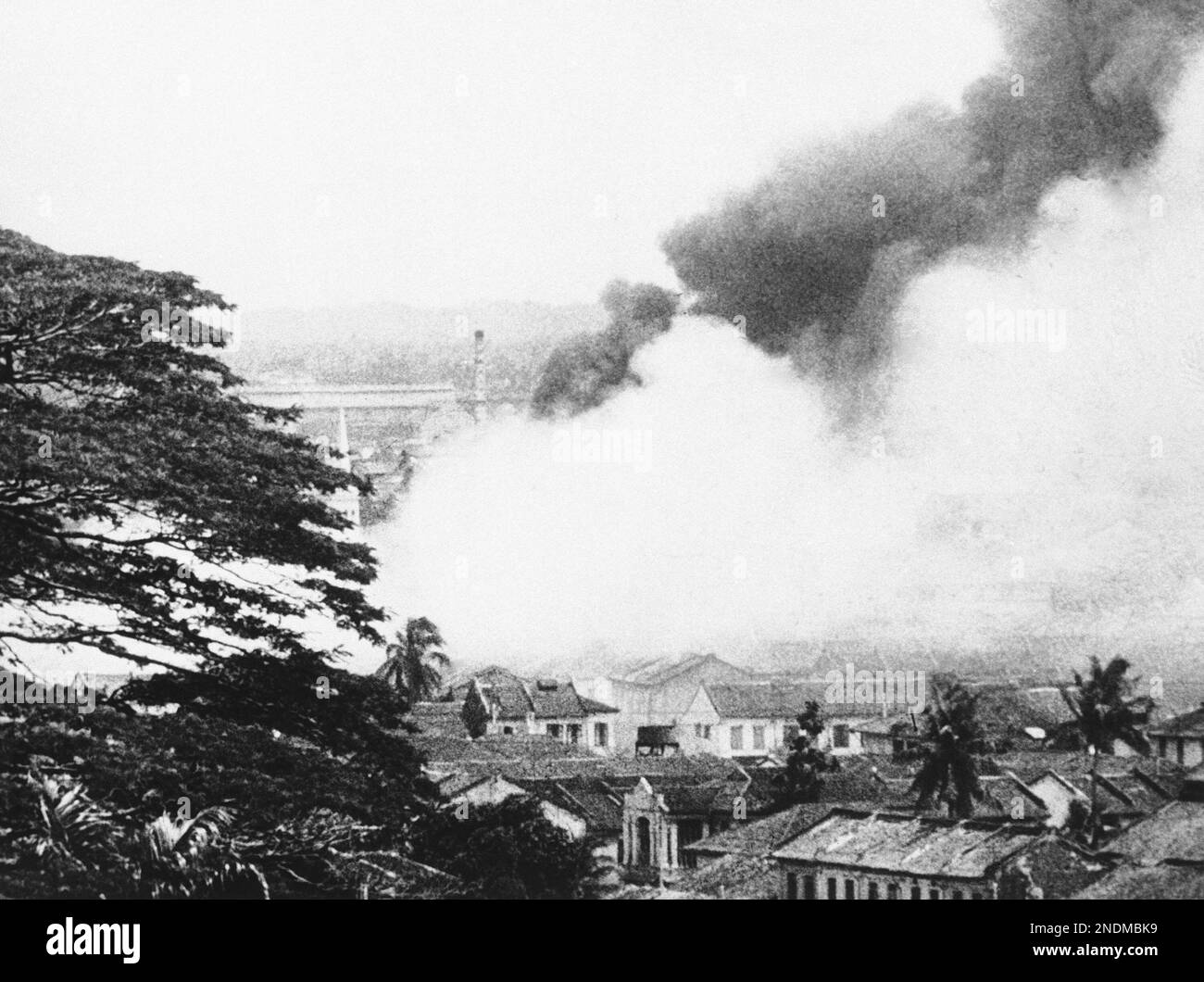 Smoke rolled from burning building in Singapore on March 17, 1942 after ...