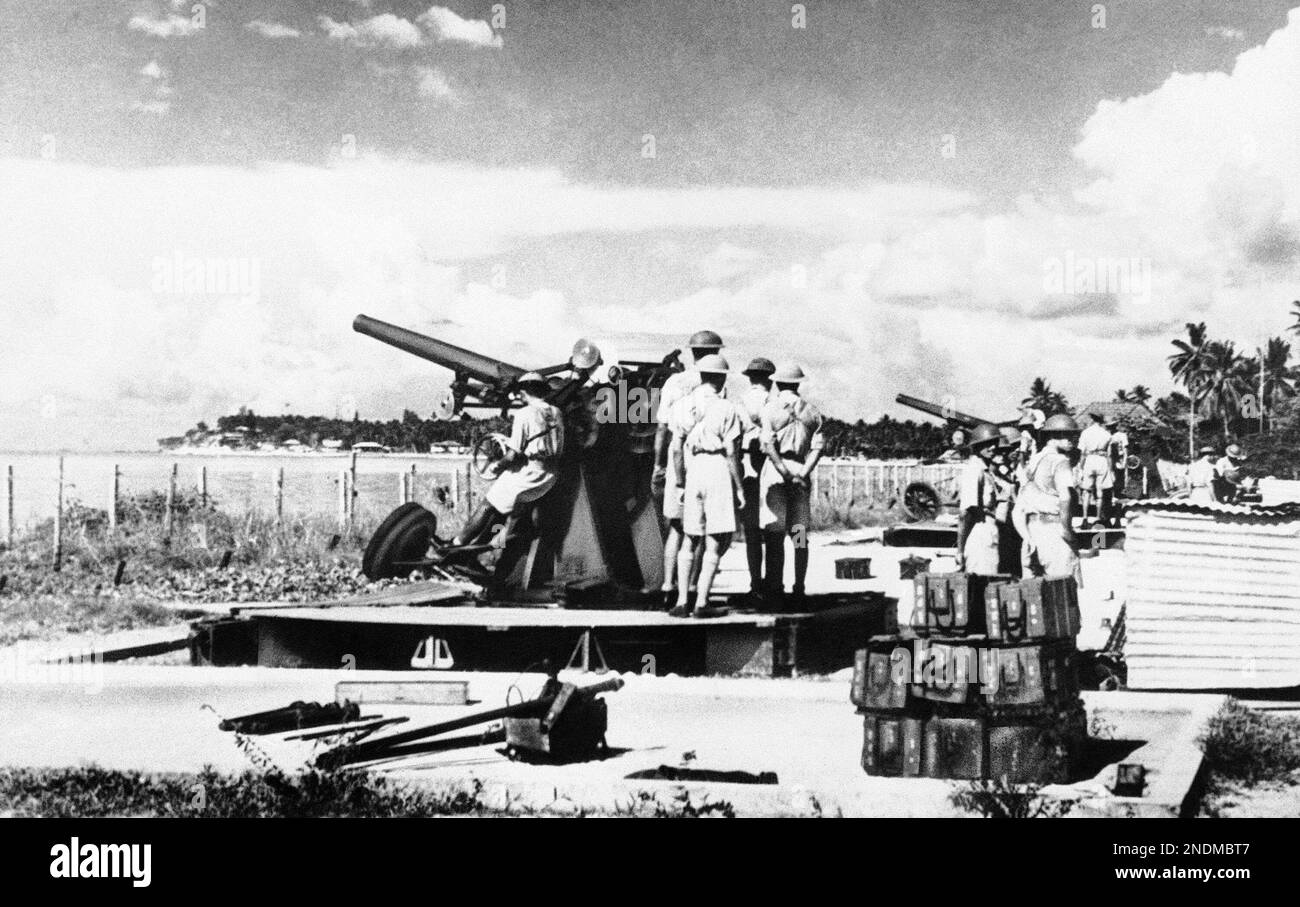 Indian gunners of a Singapore battery engage in practice in Singapore ...