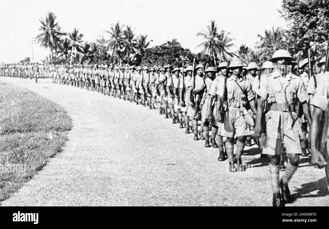 British soldiers march along a Malayan road in Singapore on August 6 ...