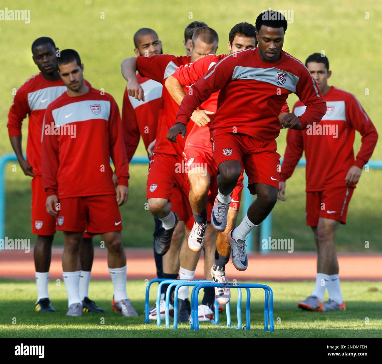 U.S. national soccer team forward Robbie Findley leads his teammates in ...