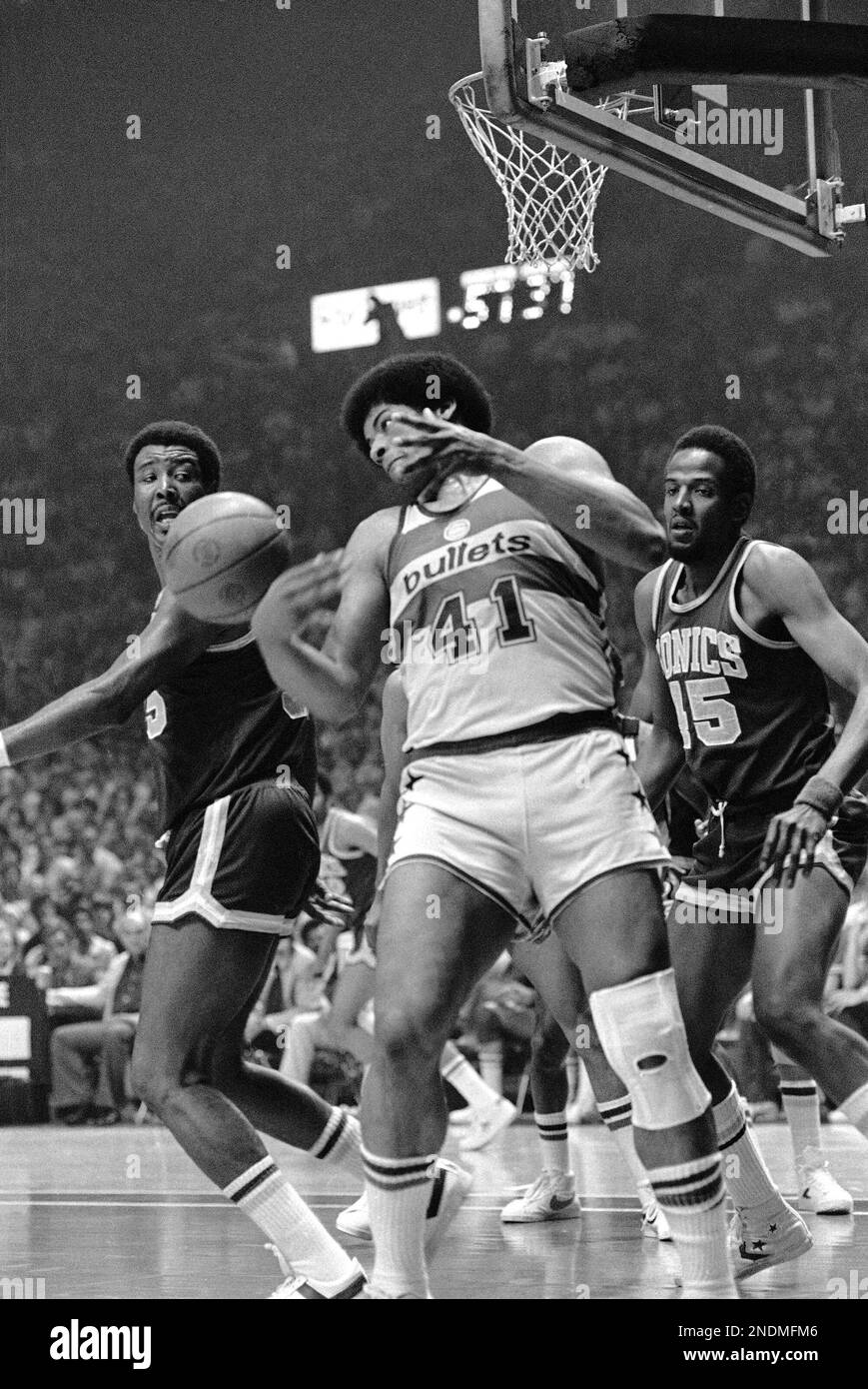 Washington Bullet Wes Unseld eyes a loose ball along with Seattle ...