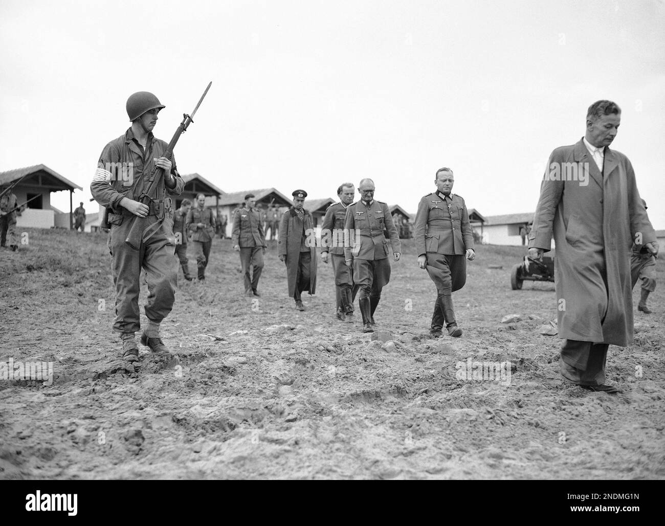 American infantryman with bayonet keeps a watchful eye on members of ...