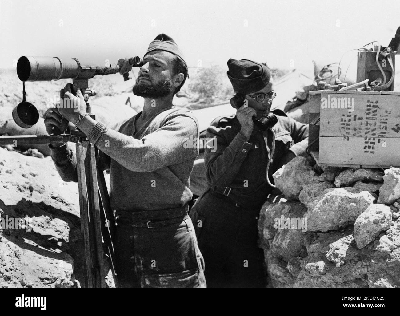 Free French soldiers, at an observation post in the Libyan desert, keep ...