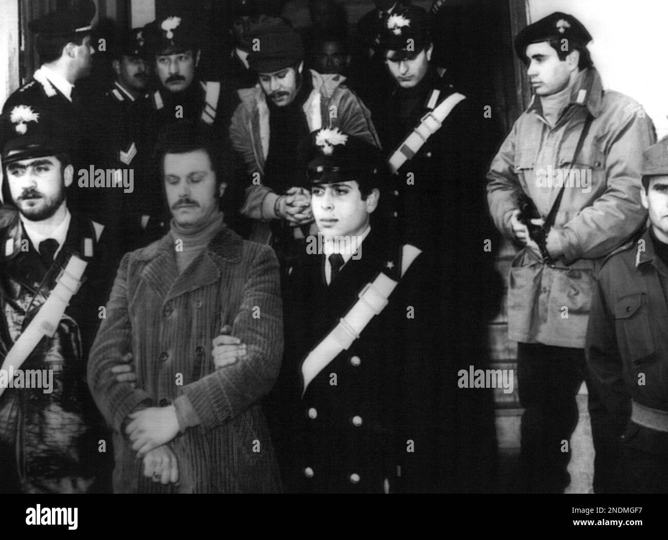 Two unidentified Ndrangheta, Calabrian mafia suspects are escorted by ...