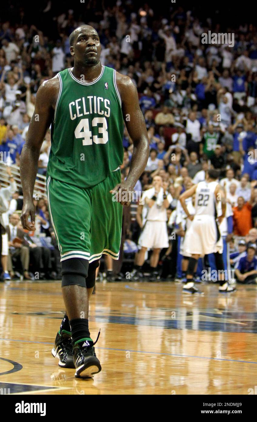 Boston Celtics center Kendrick Perkins walks off the court after he was ...