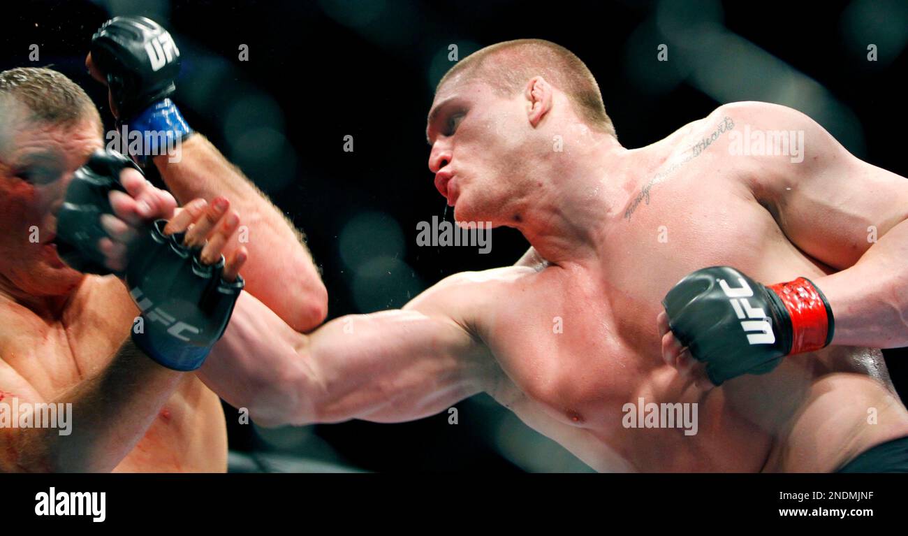 Todd Duffee, right, trades punches with Mike Russow during their UFC ...