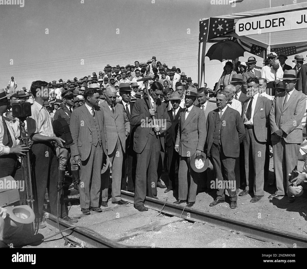 Secretary Ray Lyman Wilbur drives the last spike into the railroad ...