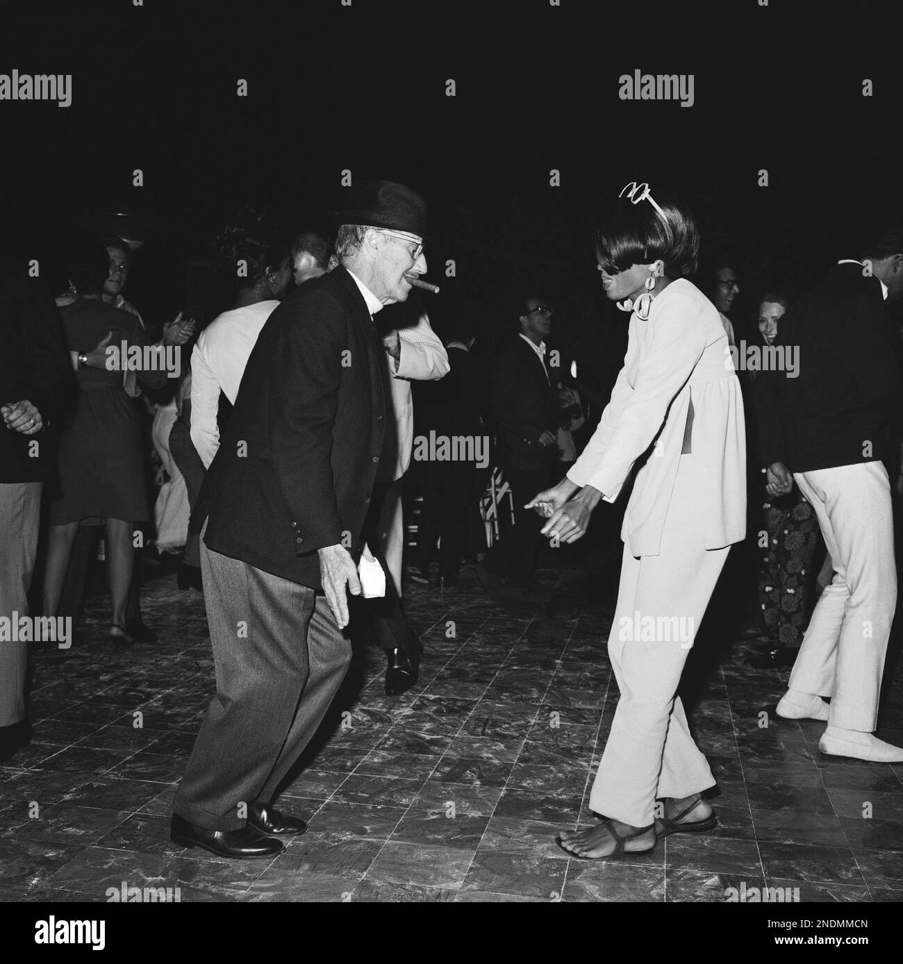 Seventy-year-old Groucho Marx showed his youth as he did the frug with ...