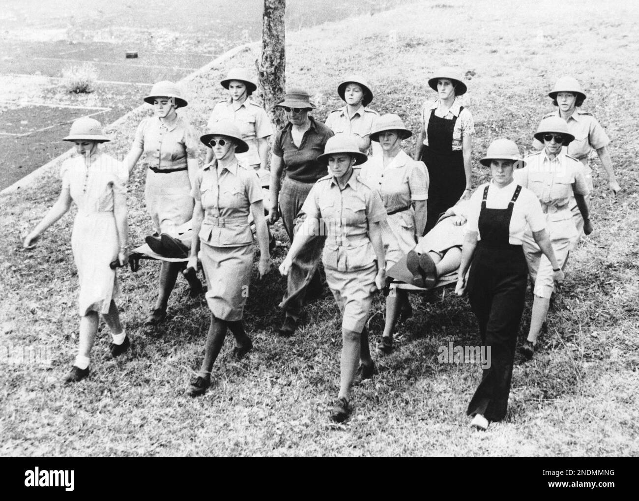 South African recruits in the British first aid nursing yeomanry carry ...