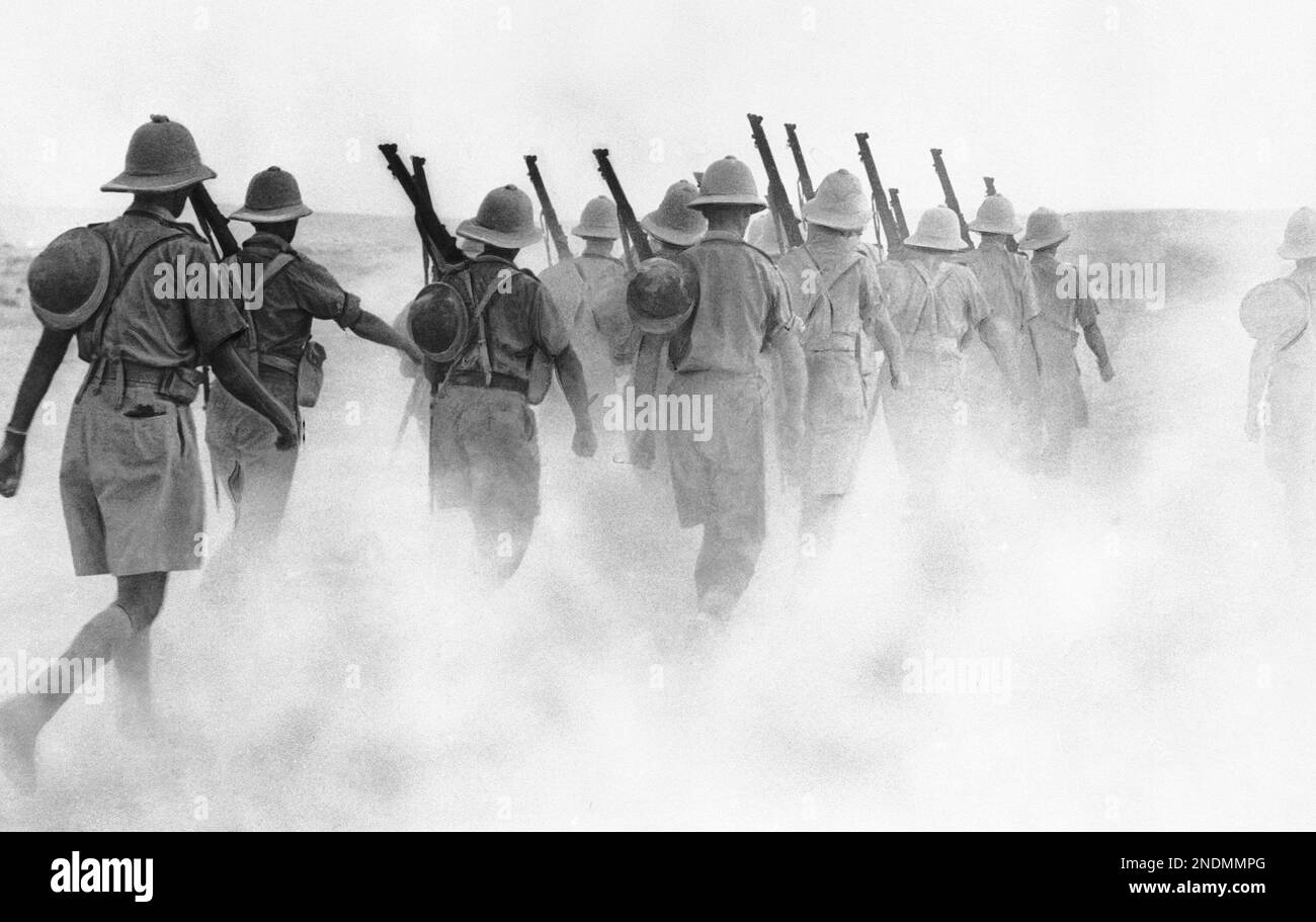 Miniature sand storms kicked up by the heels of these marching soldiers ...
