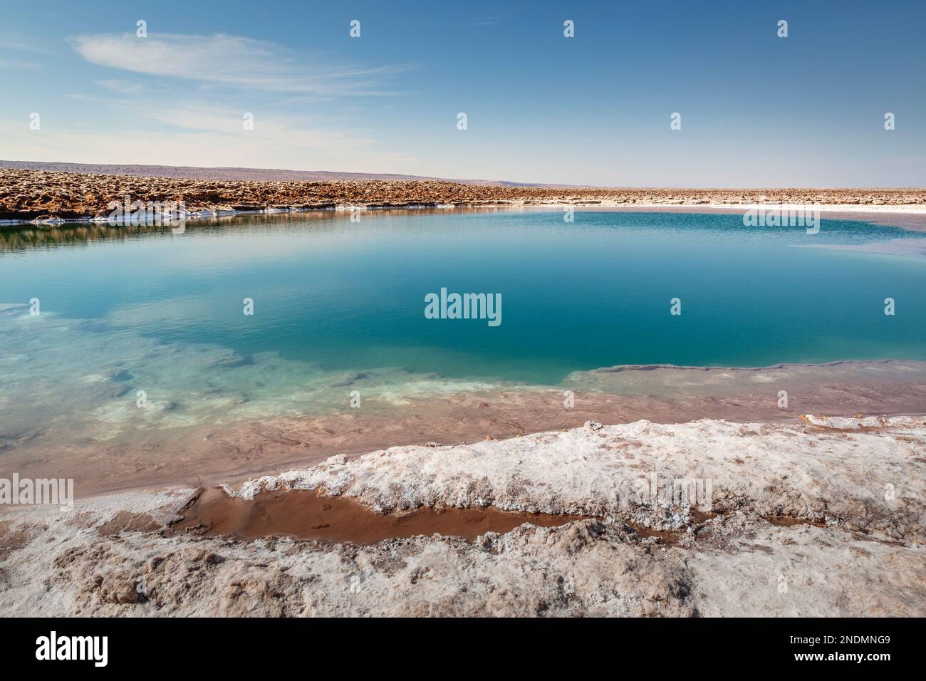 Salt lake reflection and idyllic volcanic landscape at sunrise, Atacama ...