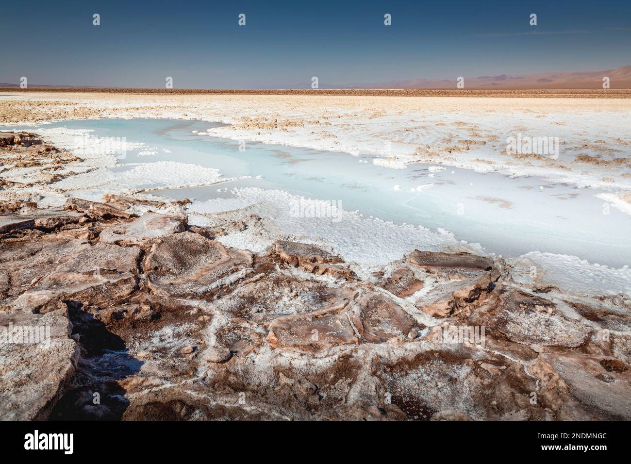 Salt lake reflection and idyllic volcanic landscape at sunrise, Atacama ...