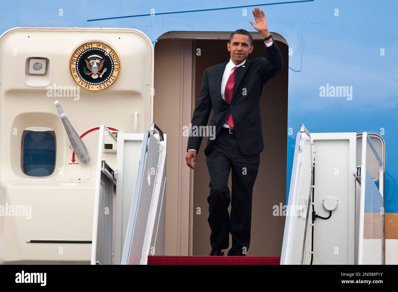 President Barack Obama waves during his arrival at Andrews Air Force ...