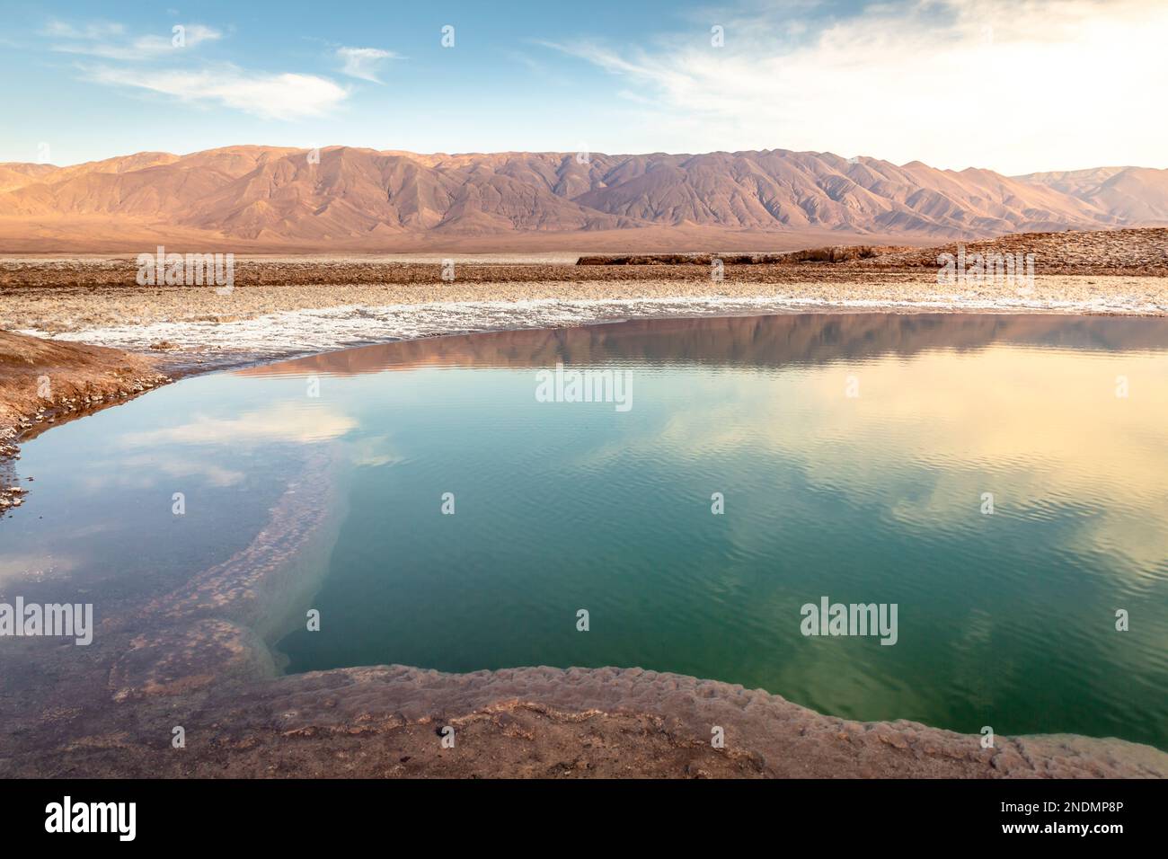 Salt lake reflection and idyllic volcanic landscape at sunrise, Atacama ...