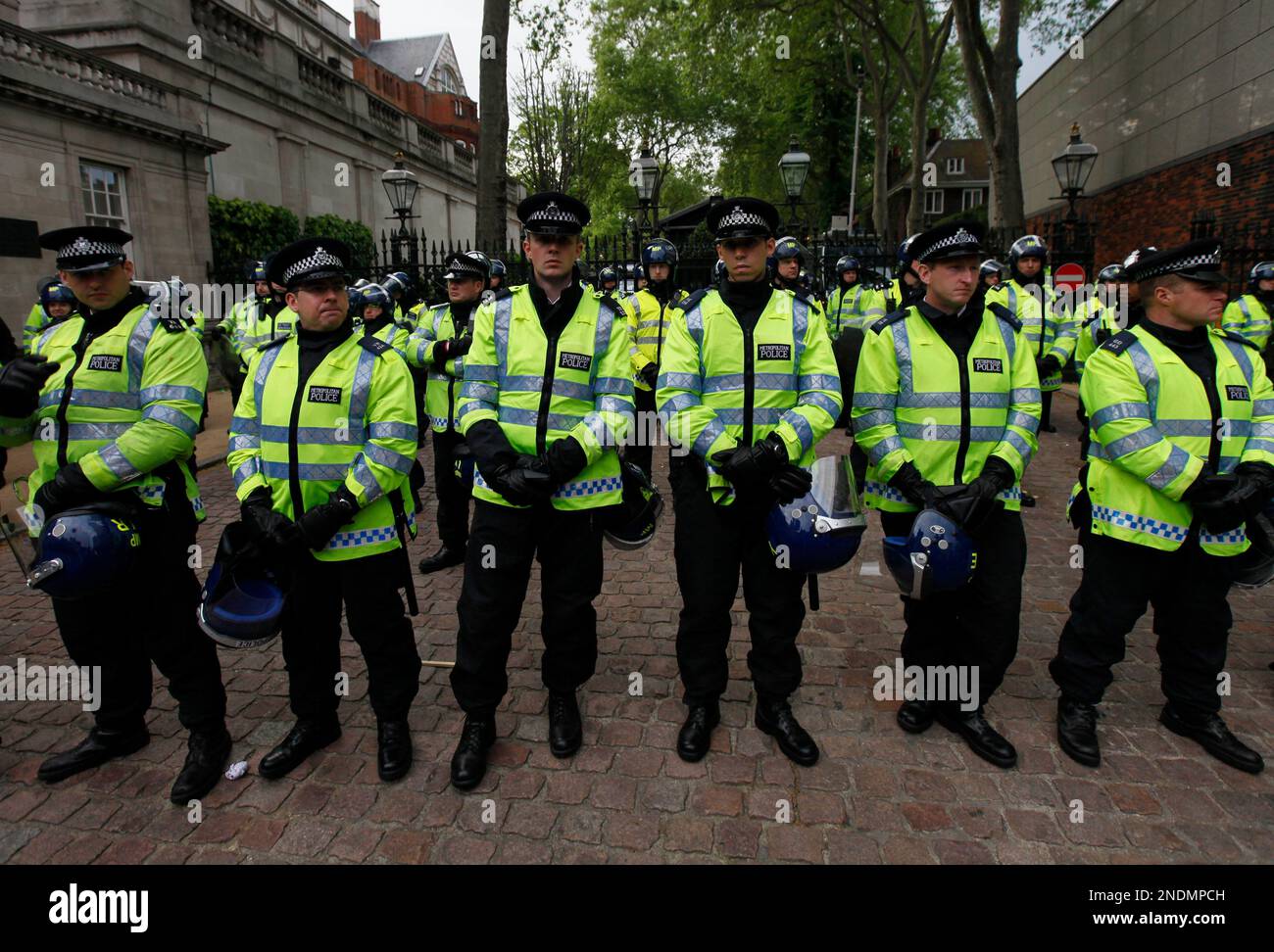 British riot police officers block the road leading to the Israeli ...