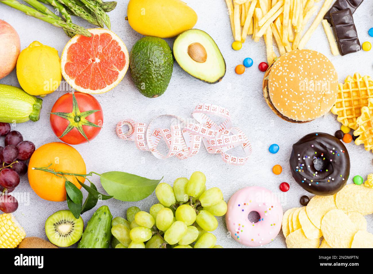 Flat lay of Healthy and unhealthy food from fruits and vegetables vs ...