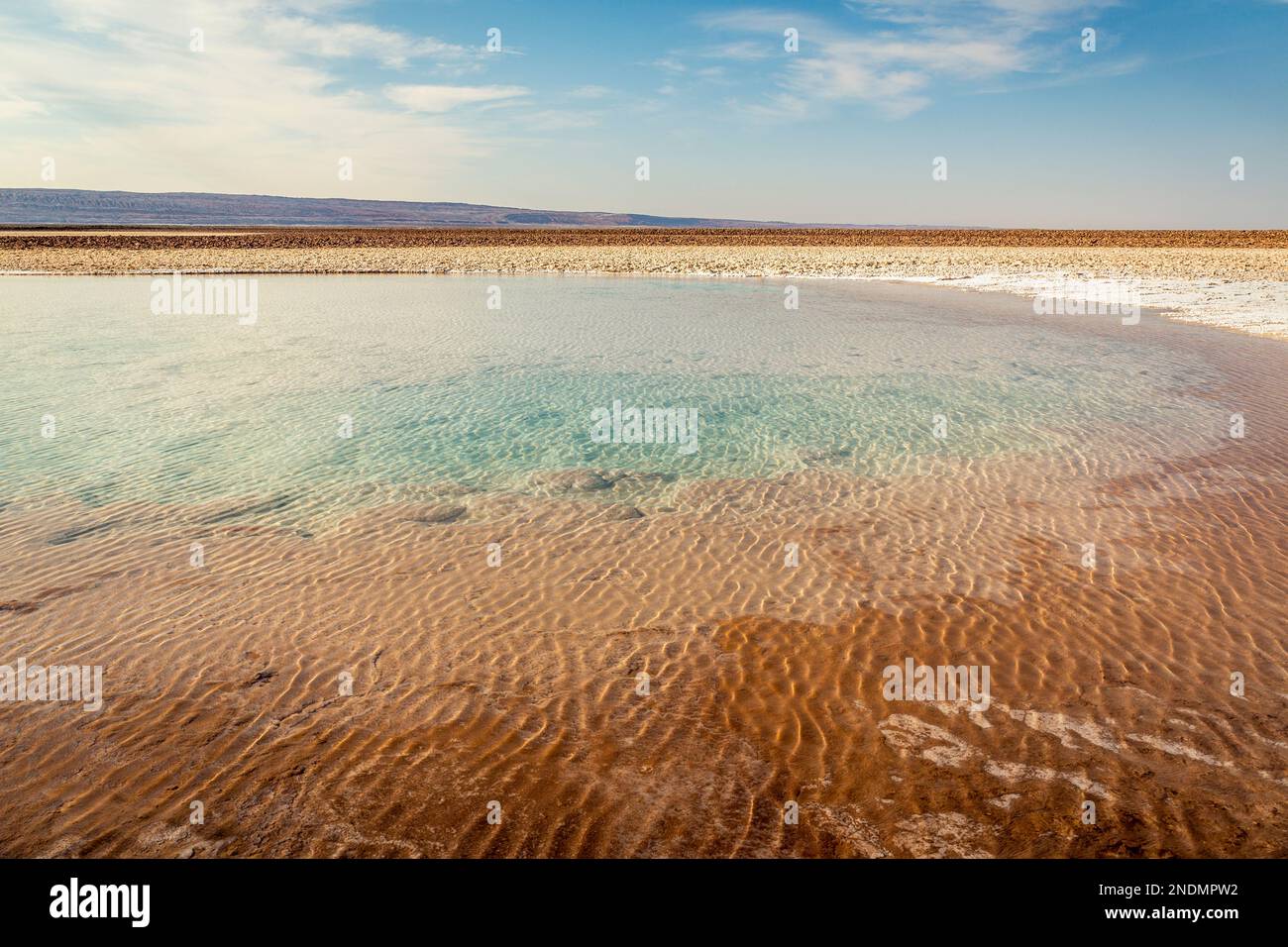 Salt lake reflection and idyllic volcanic landscape at sunrise, Atacama ...