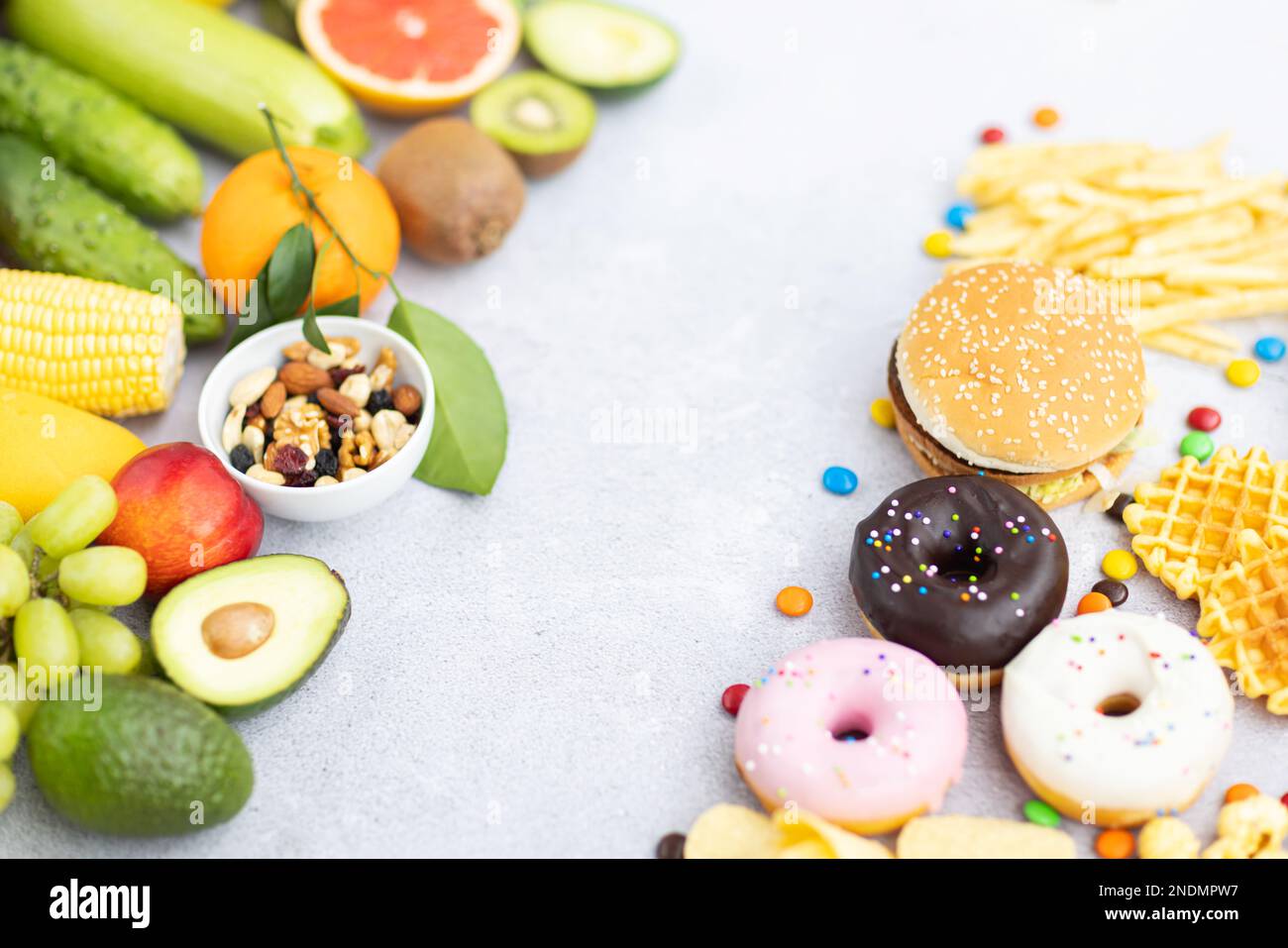 Flat lay of Healthy and unhealthy food from fruits and vegetables vs ...