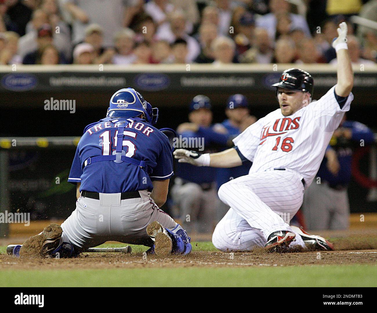 Texas Rangers catcher Matt Treanor, left, tags out Minnesota Twins ...