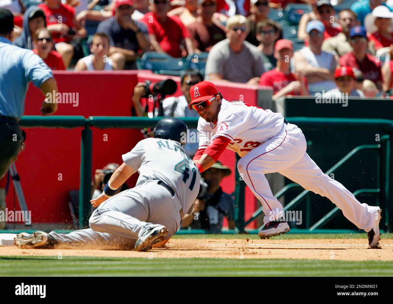 Seattle Mariners' Eliezer Alfonzo (41) is tagged out by Los Angeles ...