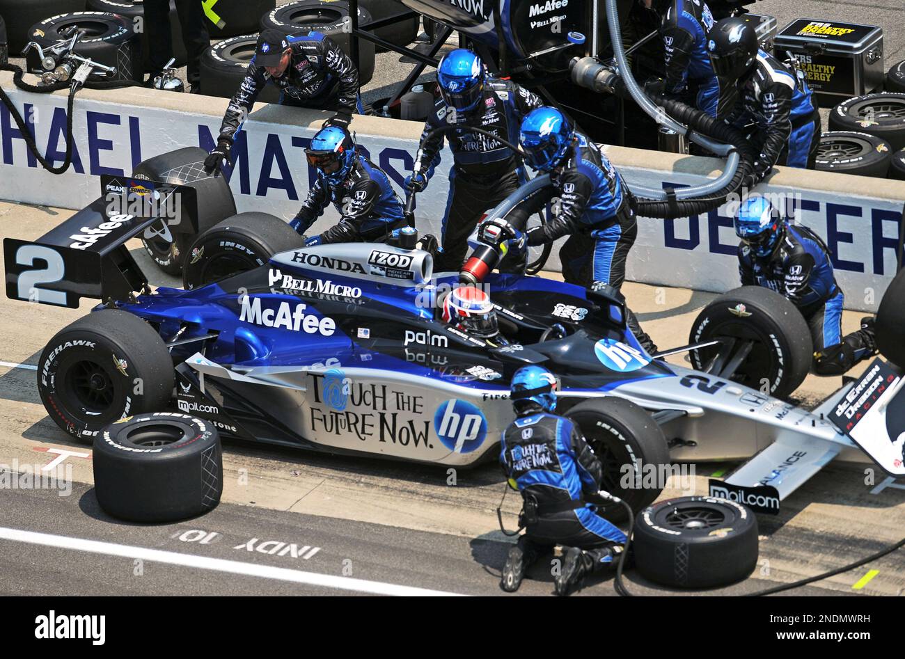 Raphael Matos, of Brazil, makes a pit stop during the Indianapolis 500 ...