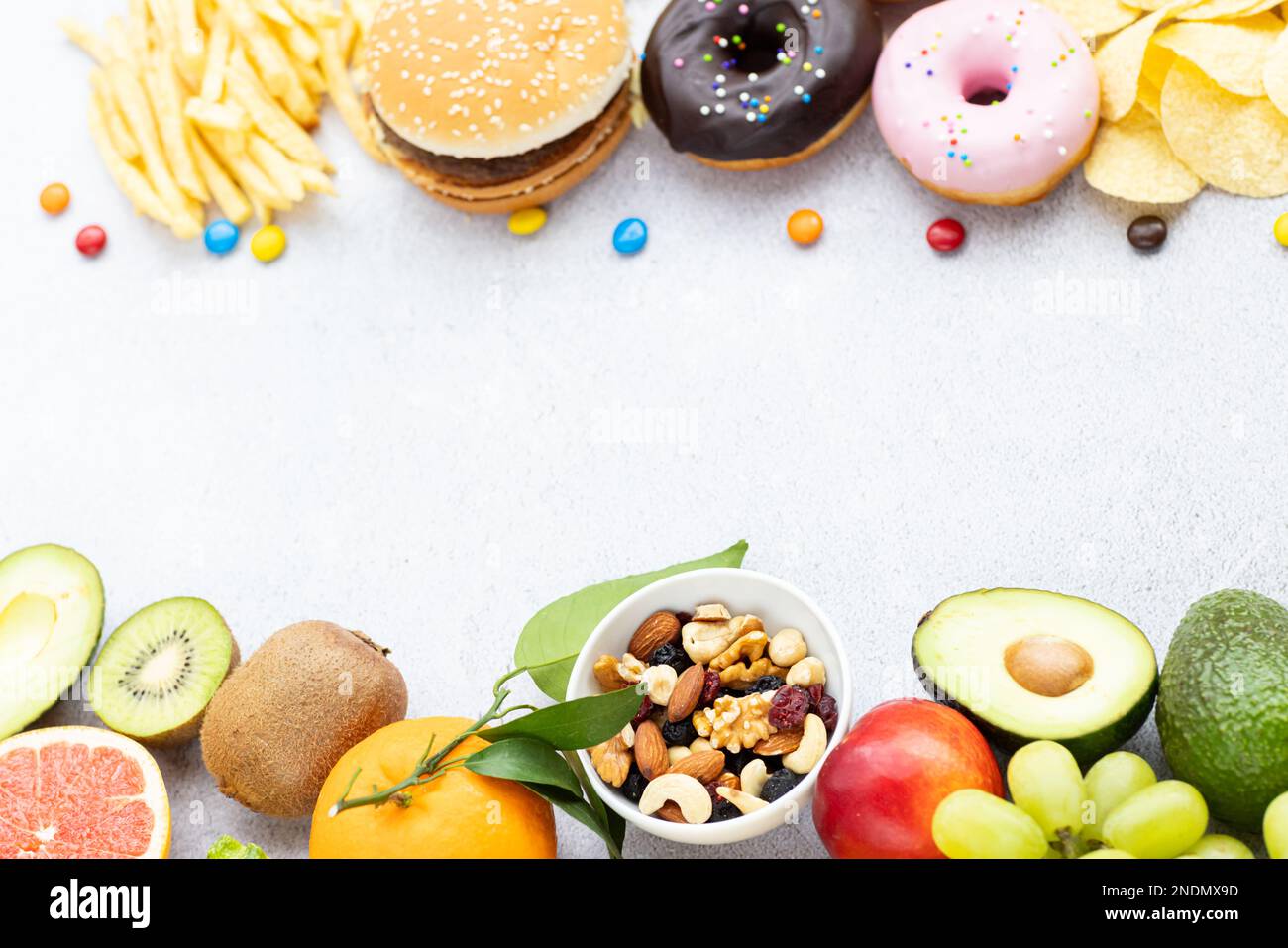 Flat lay of Healthy and unhealthy food from fruits and vegetables vs ...