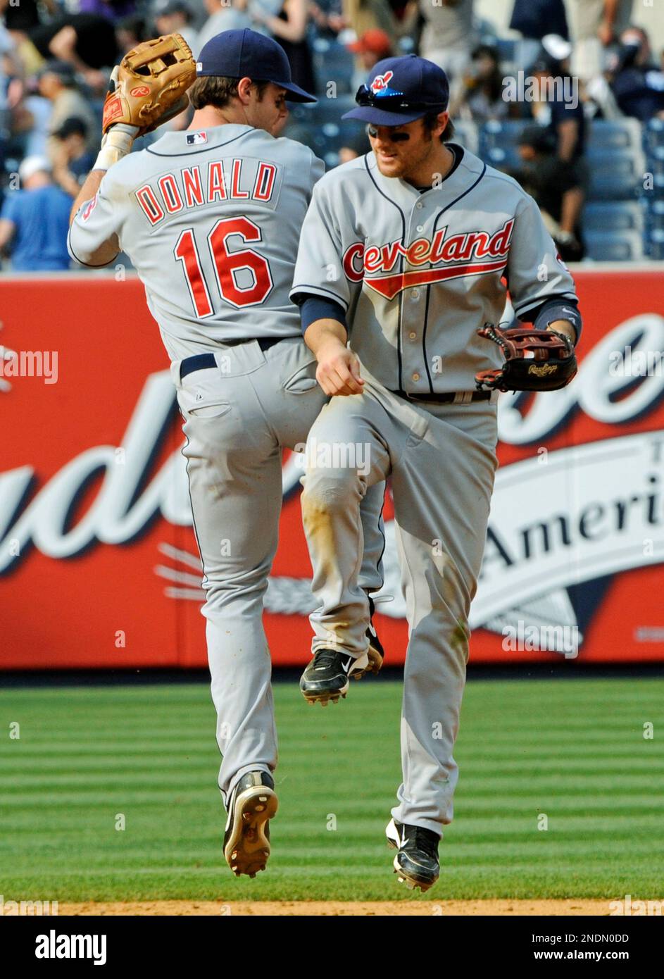 Cleveland Indians' Jason Donald (16) and Trevor Crowe celebrate after ...