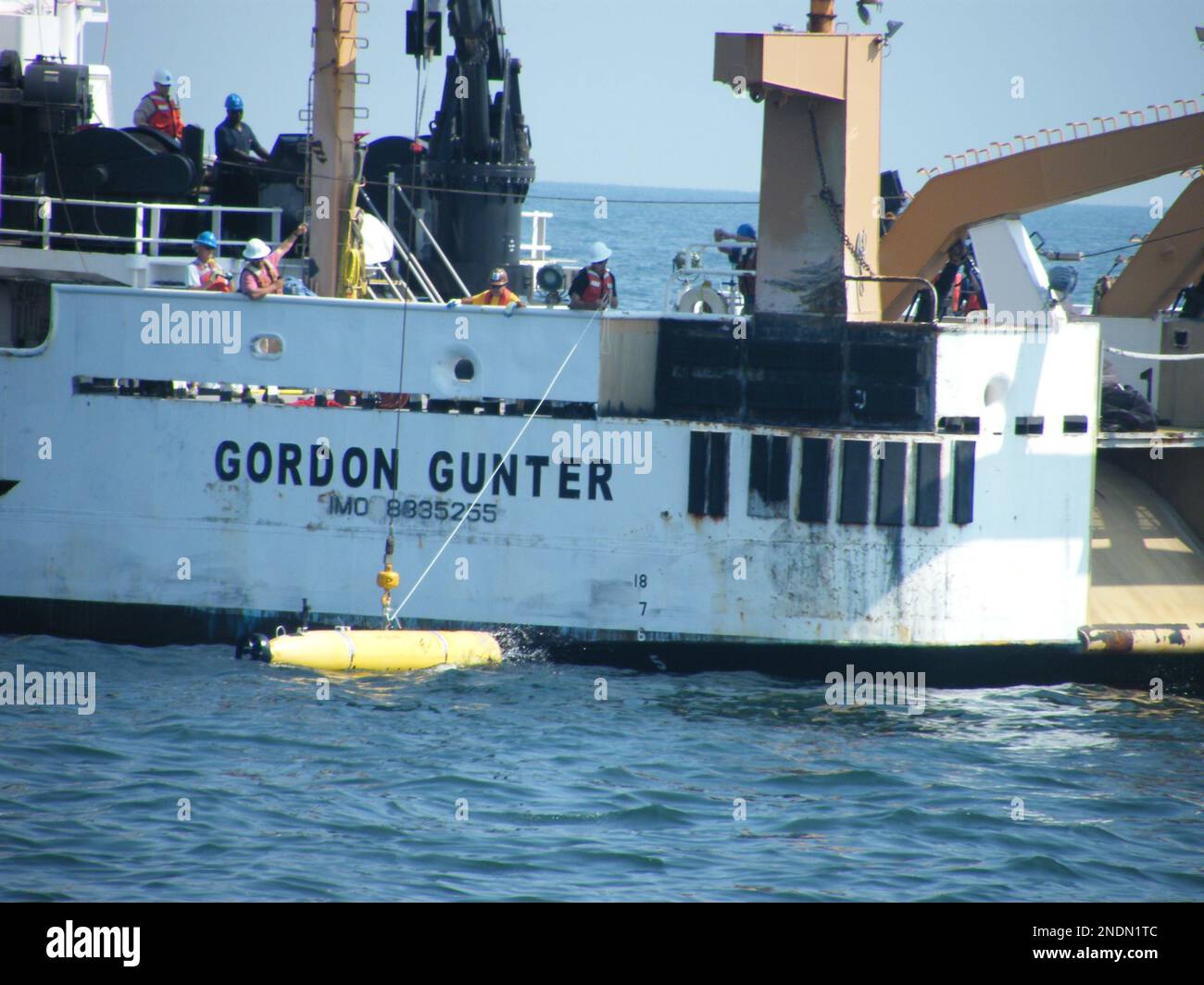 A robot sub called the Gulper the yellow torpedo-shaped object near the ...