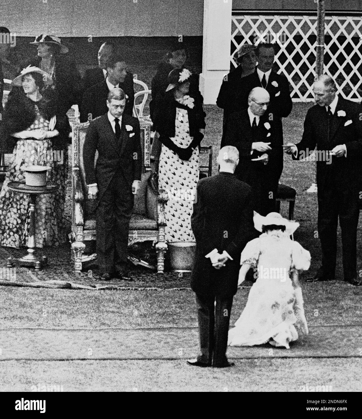Britain's King Edward VIII, standing left, received debutantes at a ...