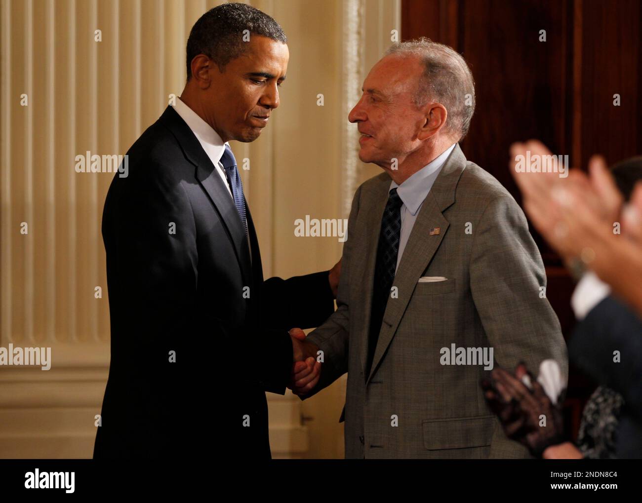 President Barack Obama greets Sen. Arlen Specter, D-Pa., at an event ...