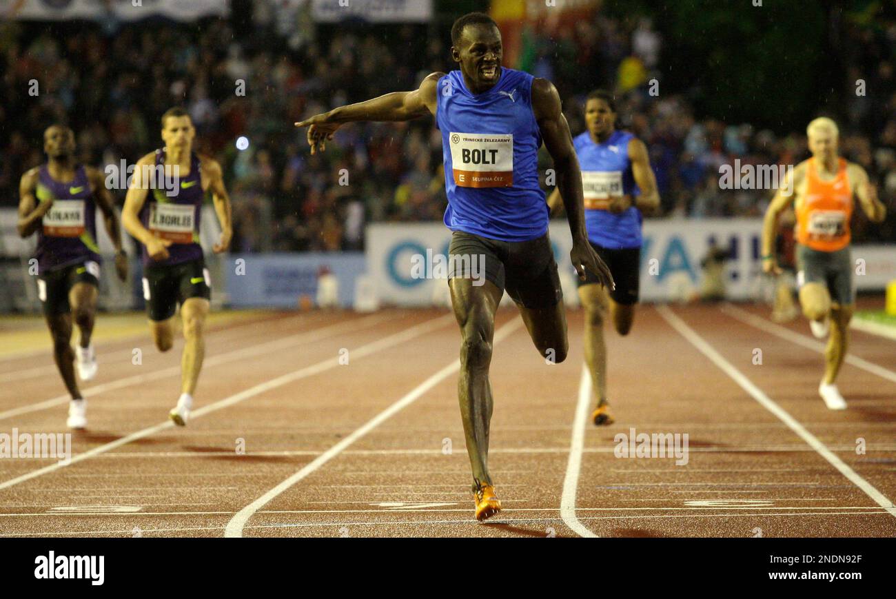 Jamaican sprinter Usain Bolt crosses a finnish line to win the men's ...