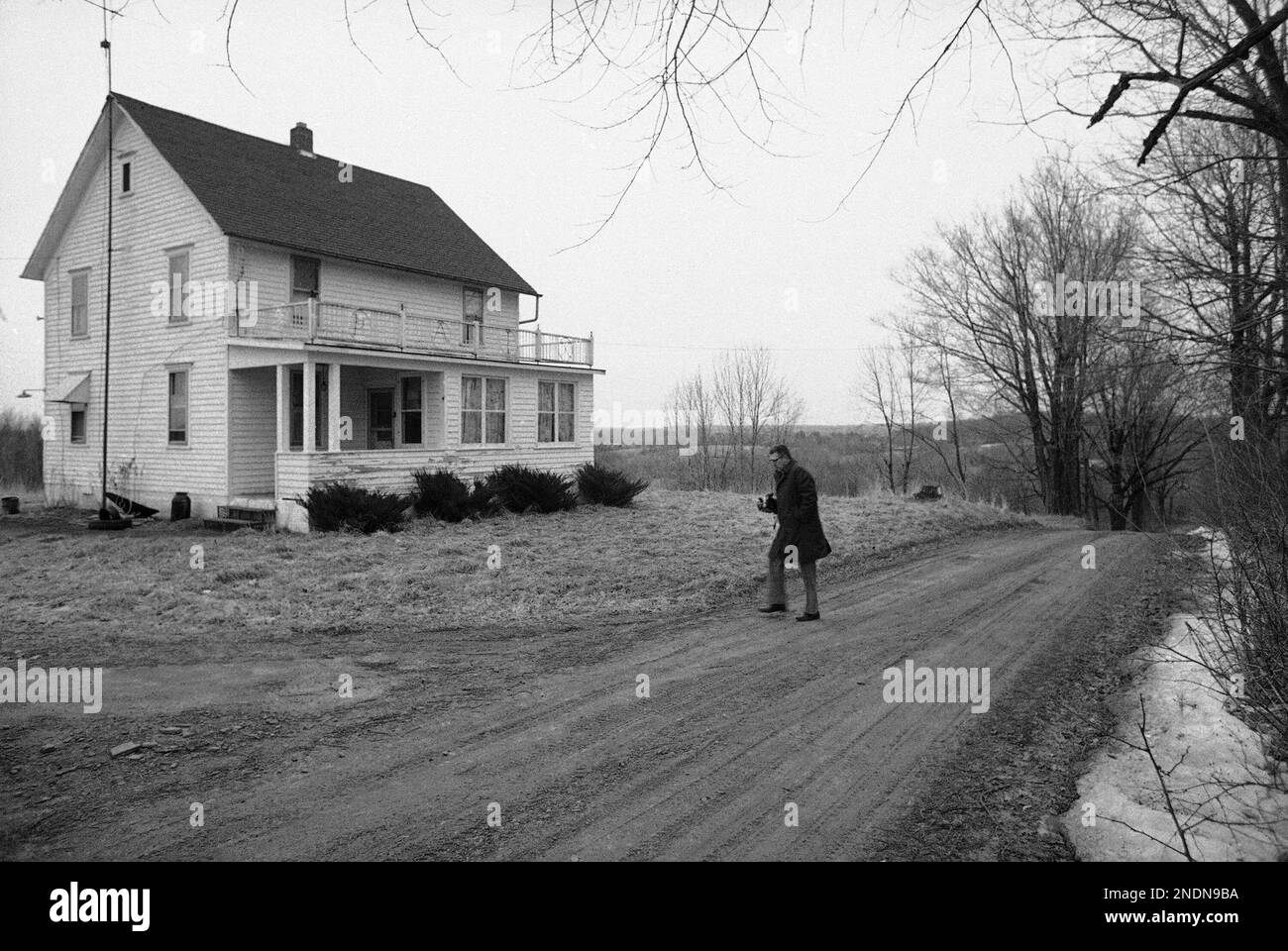 A dirt road runs by this two-story frame house in South Canaan ...