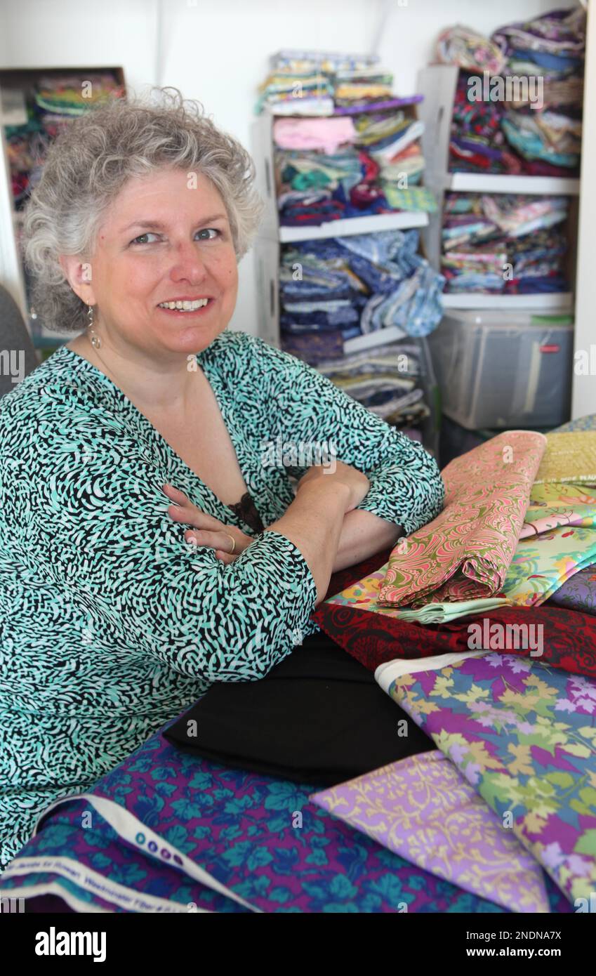 Joanne Cleaver shows off some of her new fabric at her home Monday, May ...