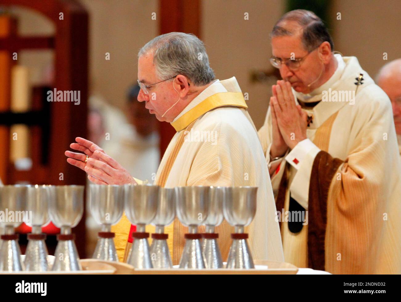Archbishop Jose H. Gomez, center with Cardinal Roger Mahony, right ...