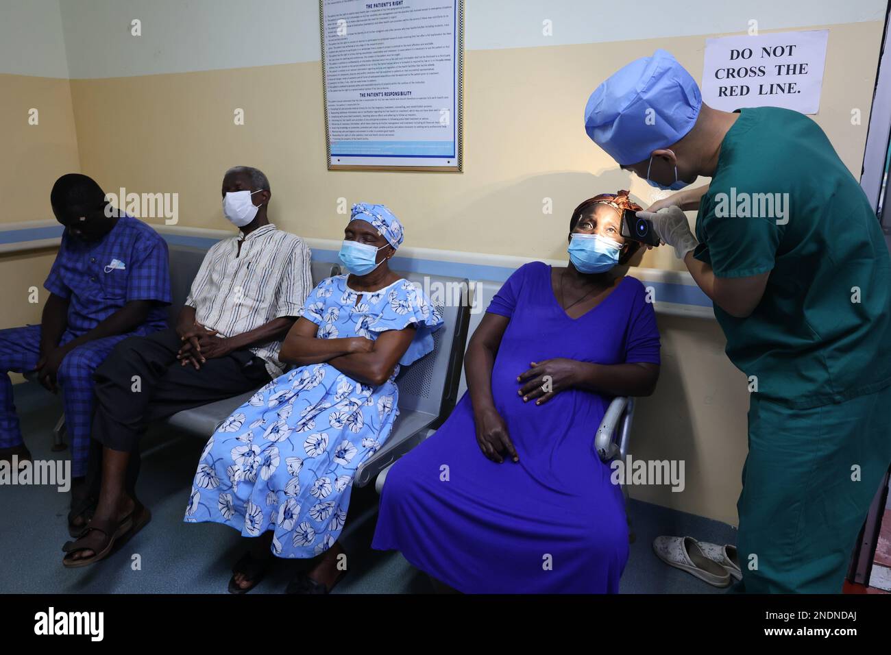 Accra, Ghana. 13th Feb, 2023. A Chinese doctor (1st R) from the Chinese ...