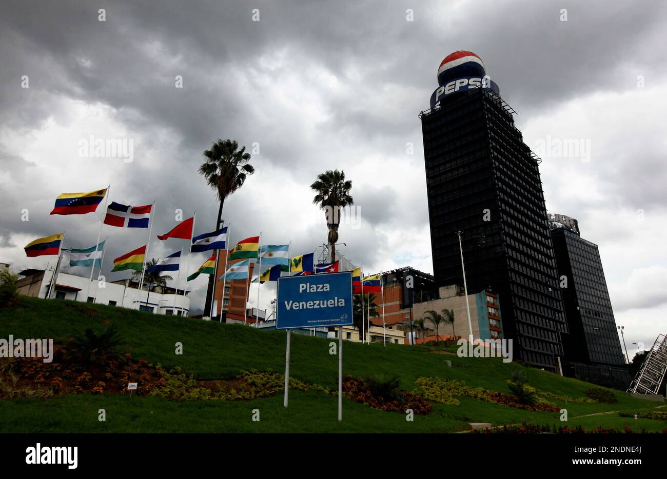 A giant globe-shaped Pepsi sign sits atop a building that surrounds ...