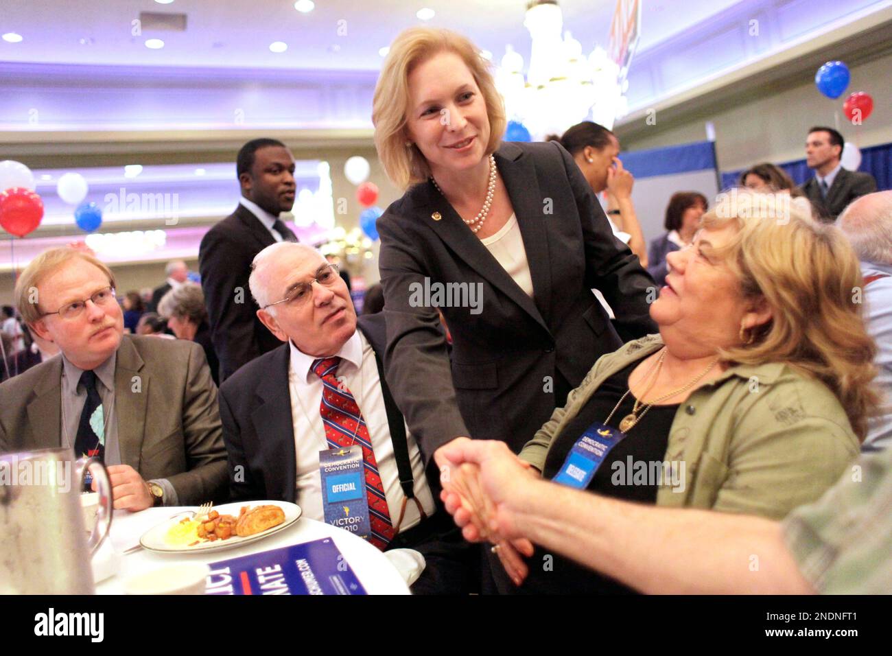 Sen. Kirsten Gillibrand, D-N.Y., center, greets delegates during a ...