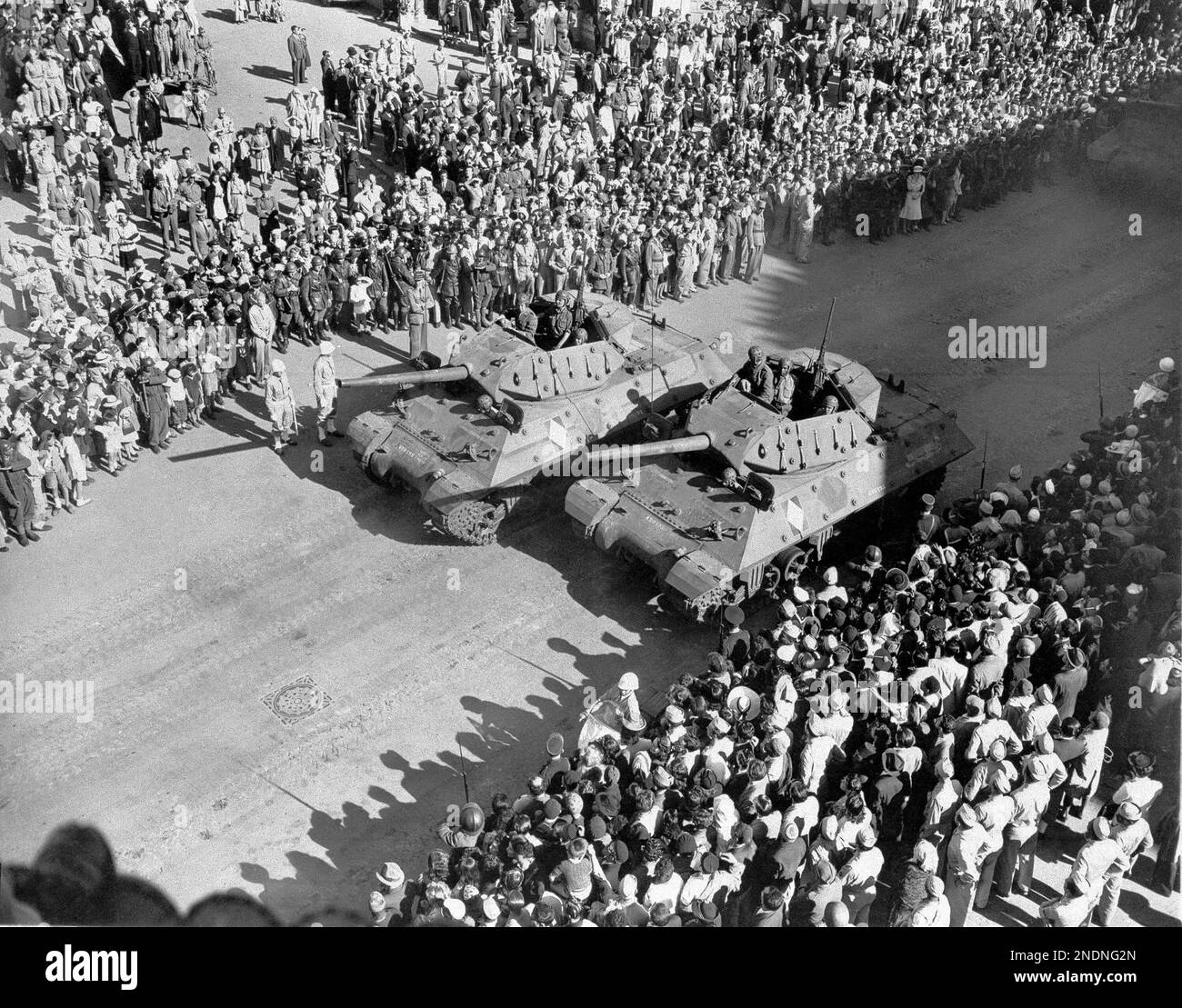 Crowd in Casablanca, French Morocco, is watching U.S.-built tanks, May ...