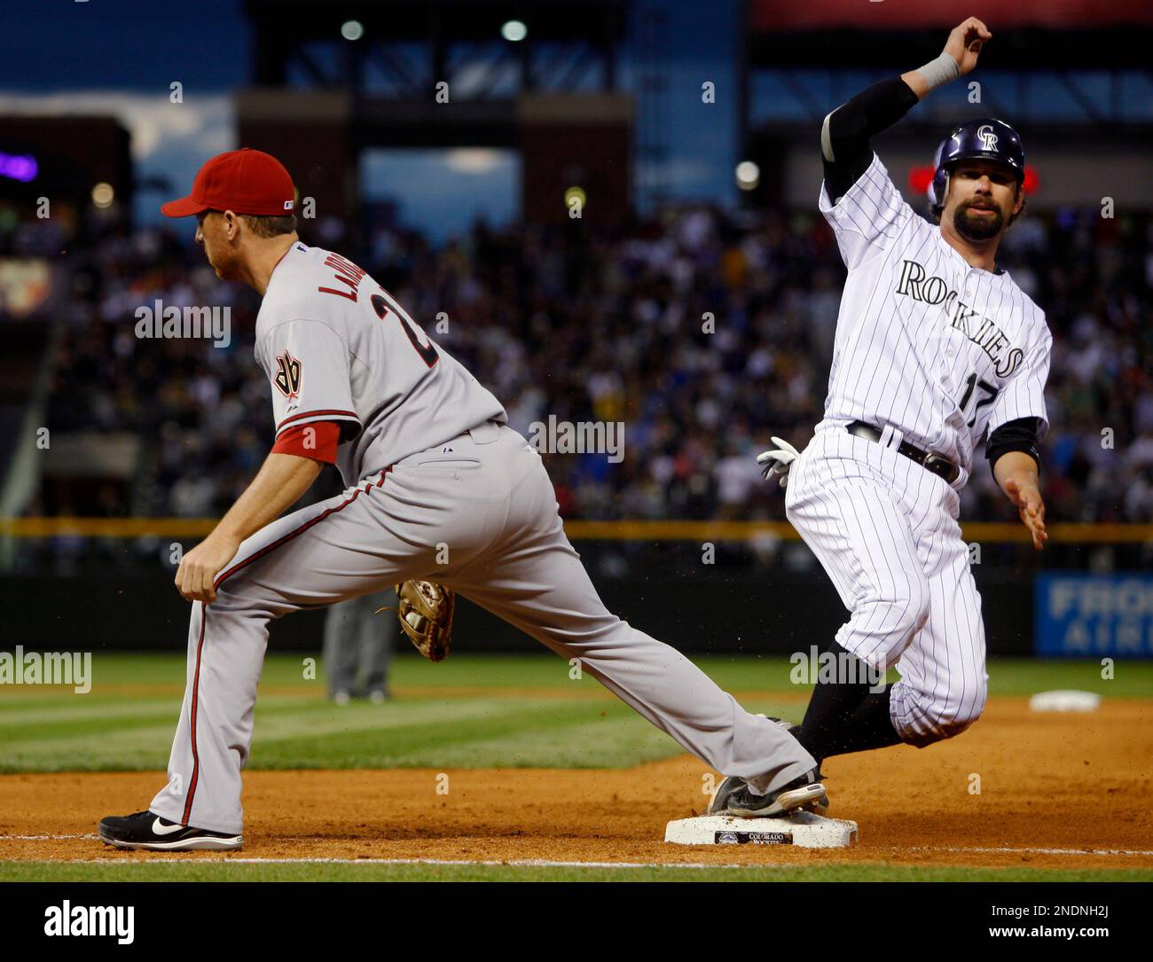Colorado Rockies' Todd Helton, right, beats the throw to first base as ...