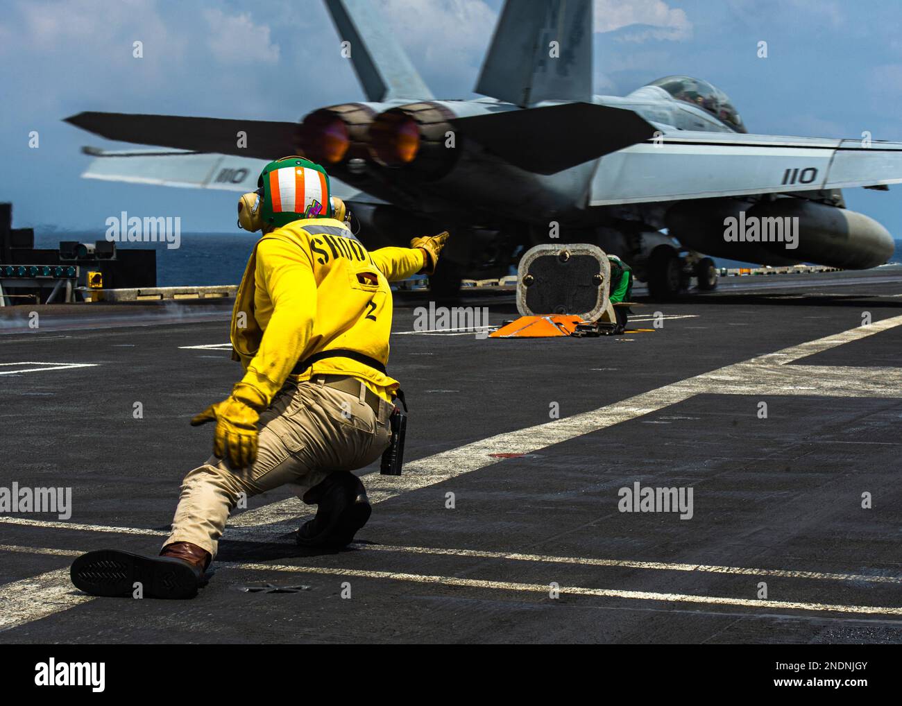 230215-N-MH015-1050 SOUTH CHINA SEA (Feb. 15, 2023) A U.S. Navy Sailor launches an F/A-18F Super ...
