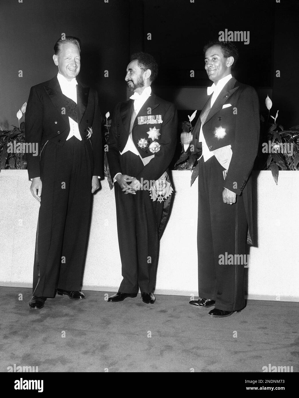 Dag Hammarskjold, United Nations secretary general, left, poses with ...