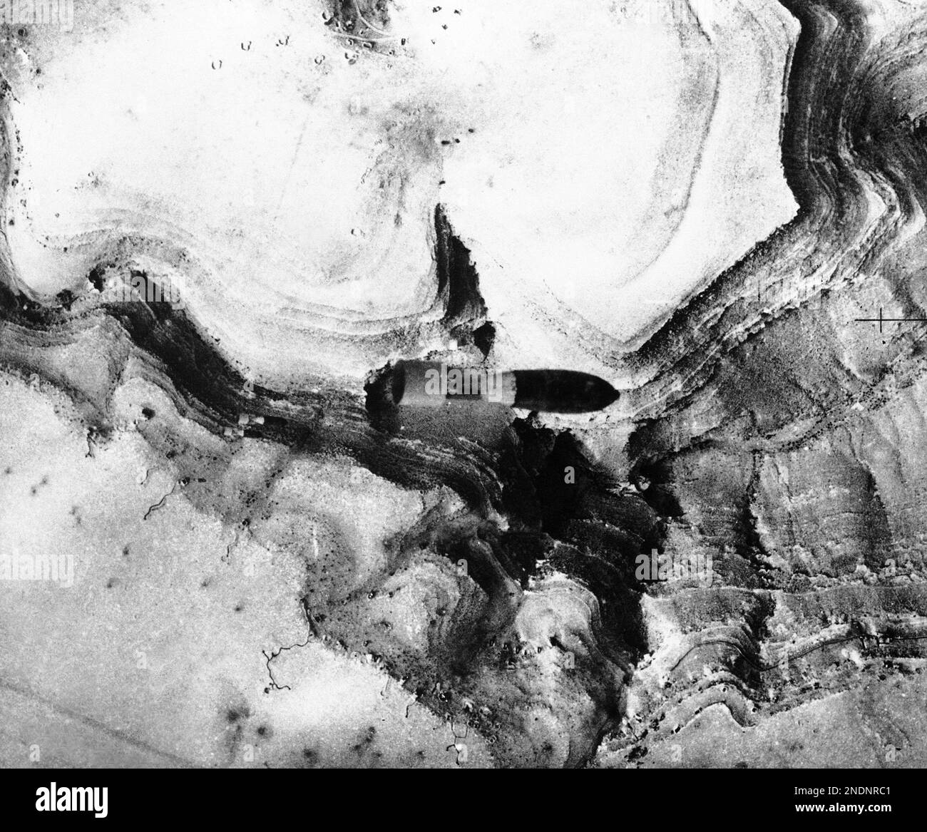 Beneath the falling bomb is the famous Halfaya pass, Libya on Feb. 2 ...
