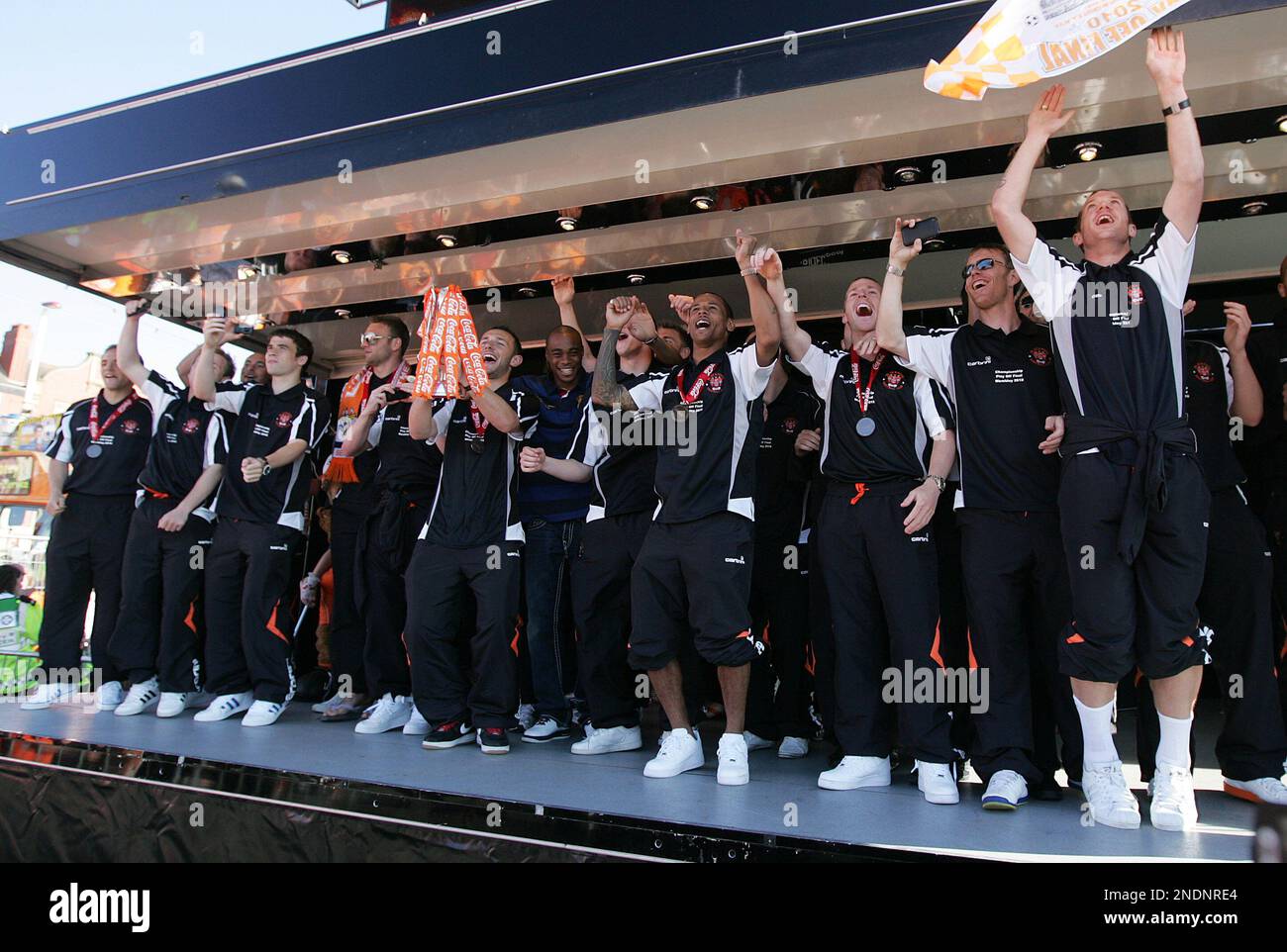 Blackpool FC players and management celebrate after an open top bus ...