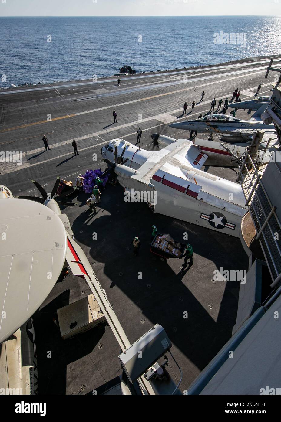 230214-N-EL850-2001 MEDITERRANEAN SEA (Feb. 14, 2023) Sailors load mail ...