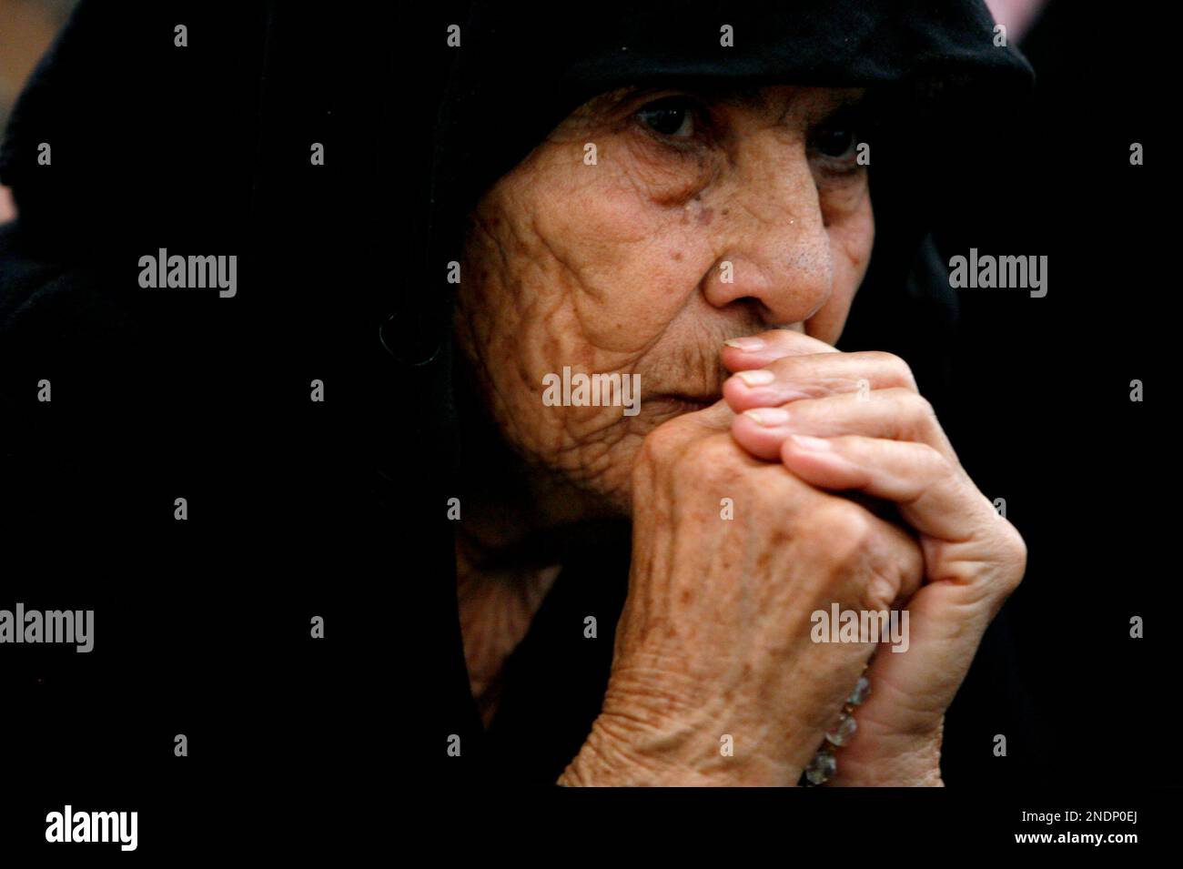 In this photo made May 9, 2010 an elderly Maronite woman attends Mass ...