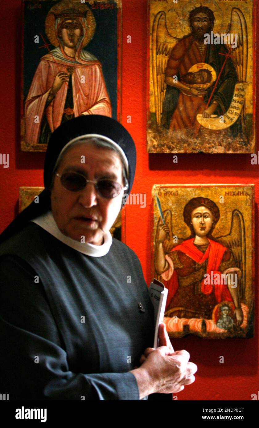 In this photo made May 9, 2010 a Catholic nun surveys a collection of ...