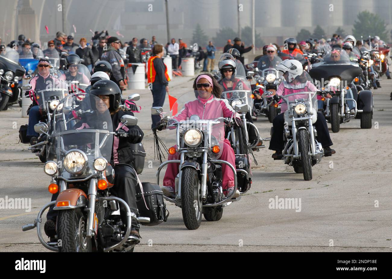 Woman ride their Harley Davidson motorcycle during a parade of the ...