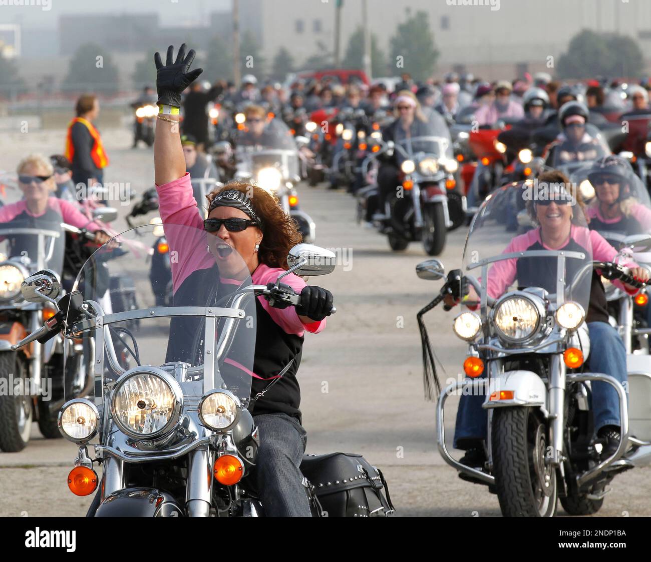 Woman ride their Harley Davidson motorcycle during a parade of the ...